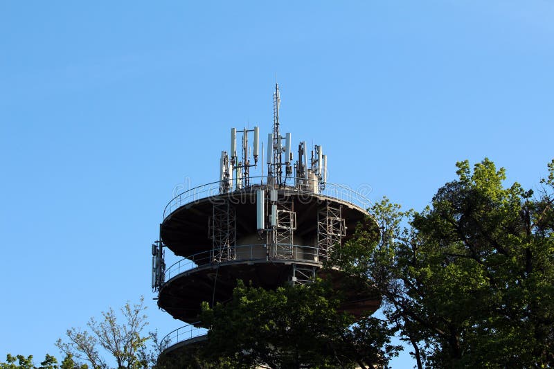 Telecommunications Tower with Multiple Antennas Above Treetops Stock ...