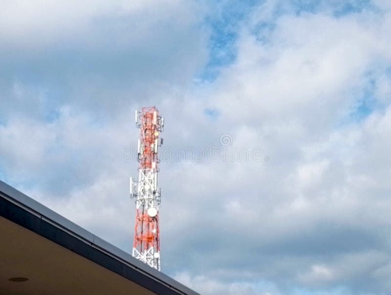 Red and White Telecommunications Tower: Cloudy Sky Stock Image - Image ...