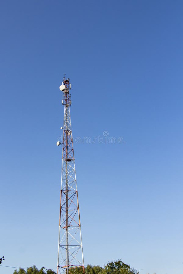 Telecommunications Tower and Satellite Dish Telecom Network on Blue Sky ...