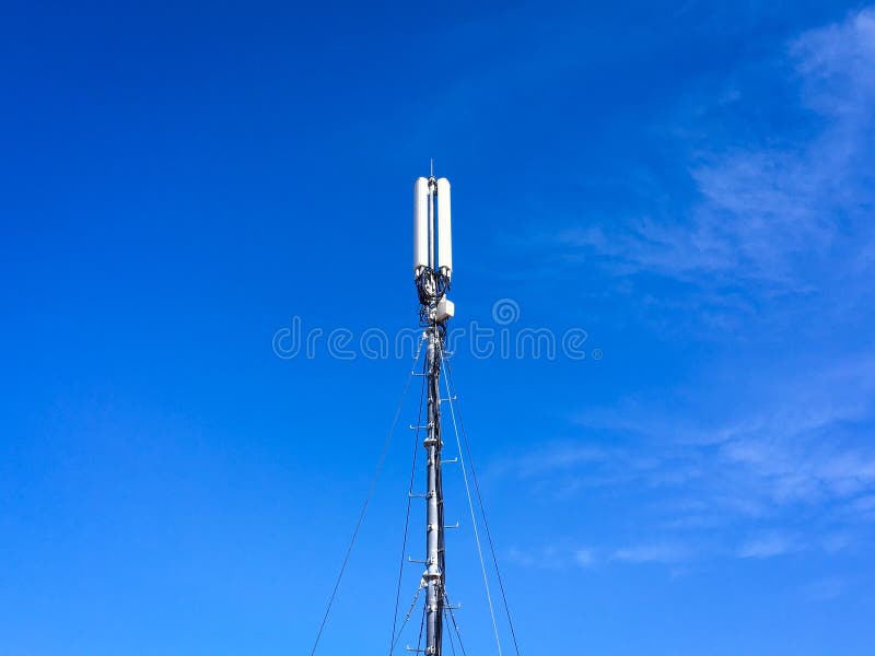 Telecommunications Tower Set Against a Blue Sky with Ample Copy Space ...