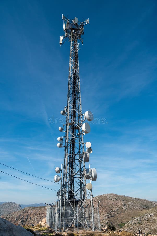 Telecommunications Tower among Mountainous Landscape Stock Photo ...
