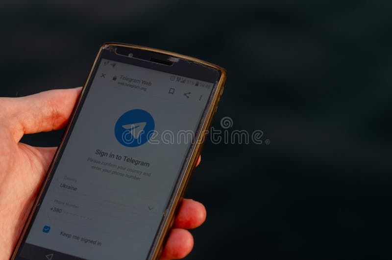 Telegram Login Screen on Smartphone Held in Hand, Closeup Outdoor View ...