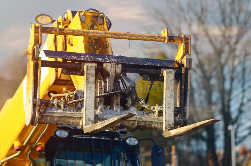 Telehandler with Raised Boom and Forks Close-up Stock Image - Image of ...