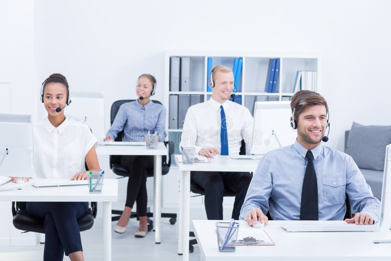 Telemarketers at work stock image. Image of company, smiling - 98553535
