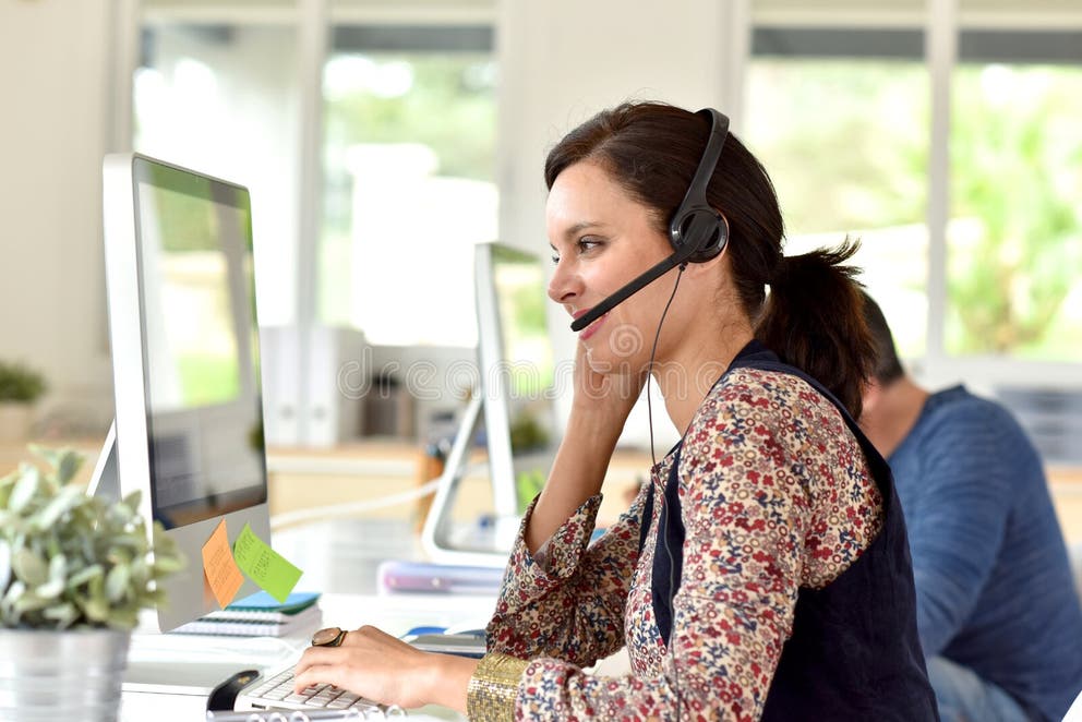 Teleoperator in Front of Desktop Stock Image - Image of people, phone ...