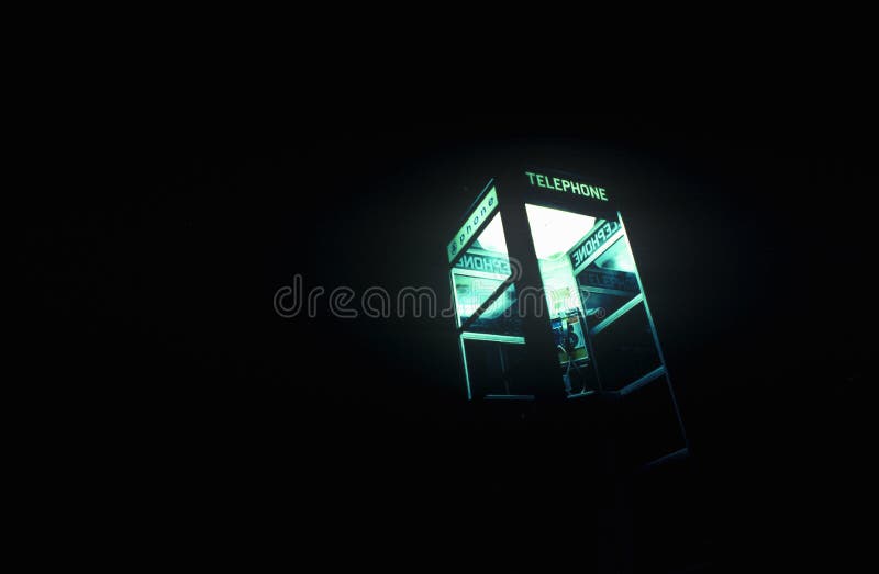 Telephone Booth at Night with Interior Lights Stock Image - Image of ...