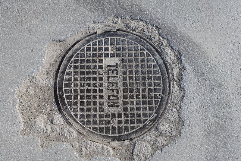 Telephone Infrastructure Manhole Cover, Iron Manhole Cover Stock Photo ...