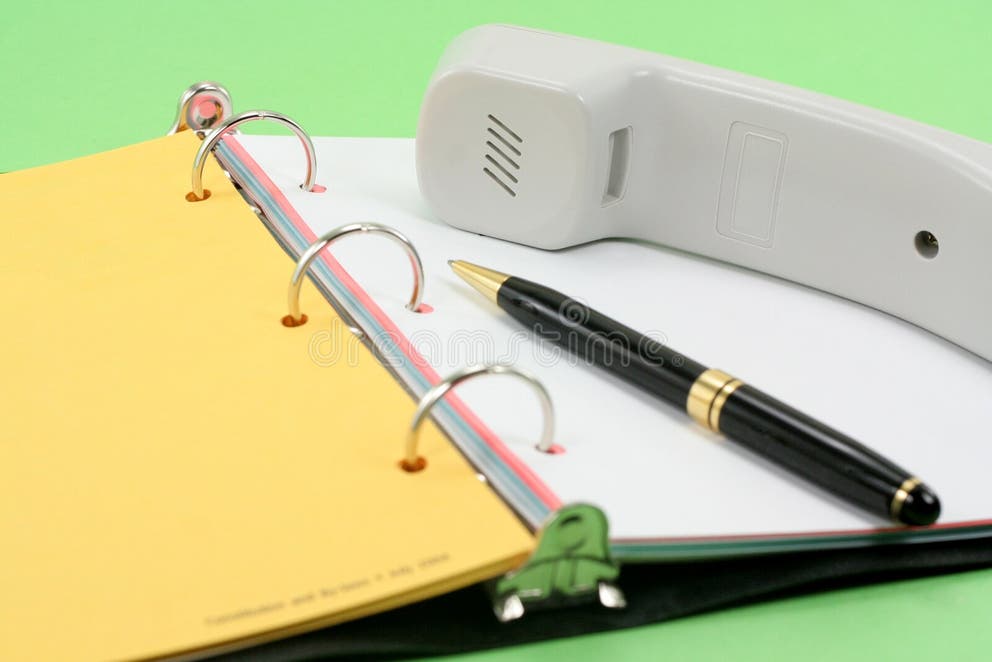 Telephone and notebook stock image. Image of finance, business - 1428121