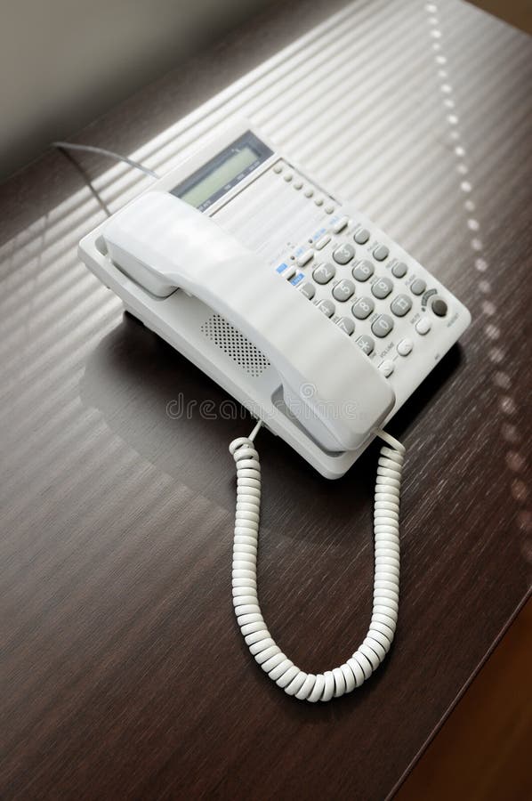White Office Desk Telephone with Coiled Phone Cord Stock Image - Image ...
