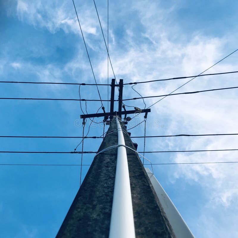 Telephone Pole Against a Blue Sky. Stock Image - Image of extreme ...
