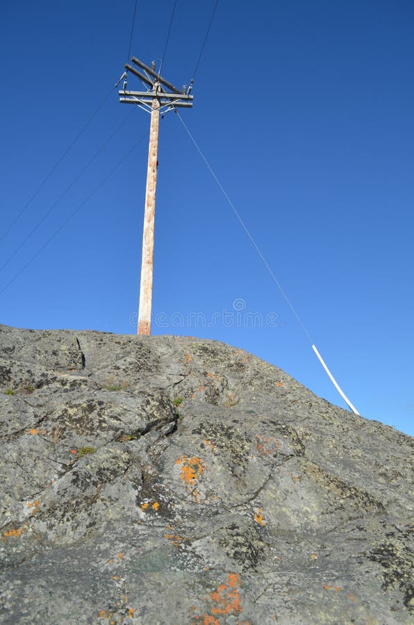 Telephone pole on rock stock photo. Image of pole, clear - 27984690