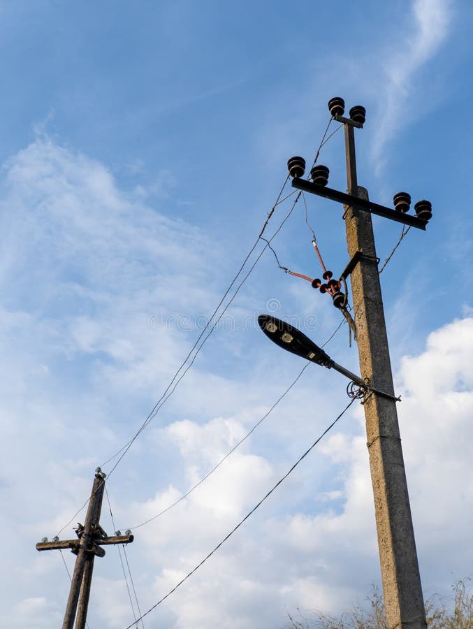 A Telephone Pole with a Street Light on Top of it Stock Image - Image ...