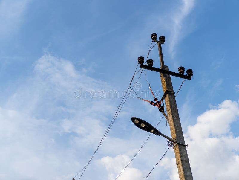 A Telephone Pole with a Street Light on Top of it Stock Image - Image ...