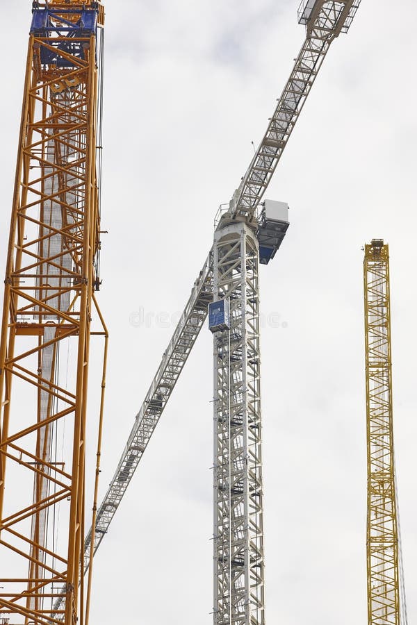 Telescopic Cranes Under a White Sky. Construction Industry Stock Photo ...