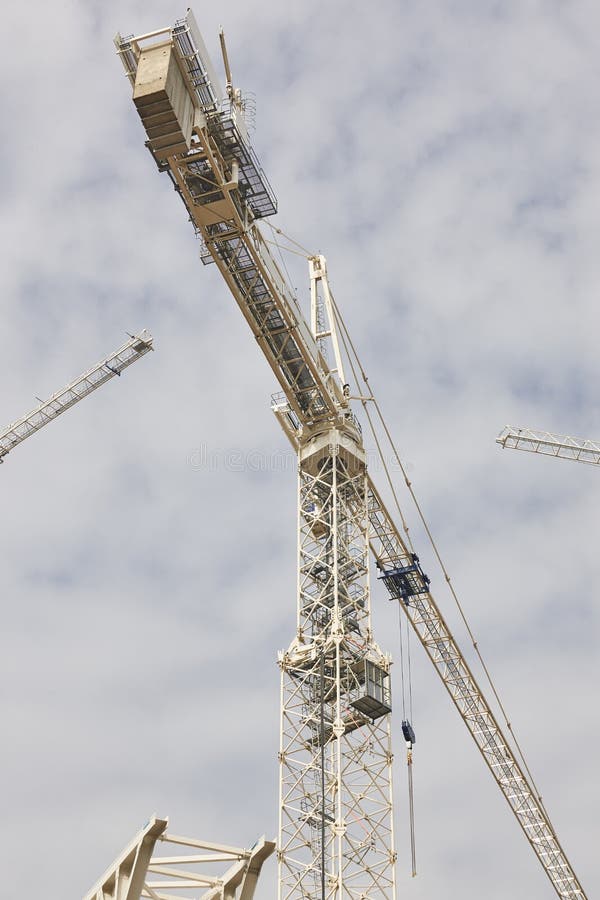 Telescopic Cranes Under a White Sky. Construction Industry Stock Image ...