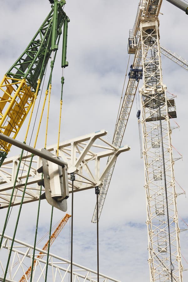 Telescopic Cranes Under a White Sky. Construction Industry Stock Photo ...