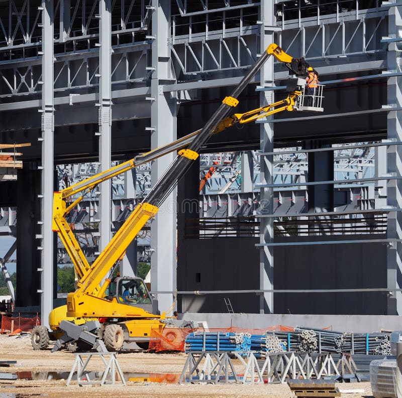 A Telescopic Handler Brings Up Some Steel Bars To the First Floor of ...