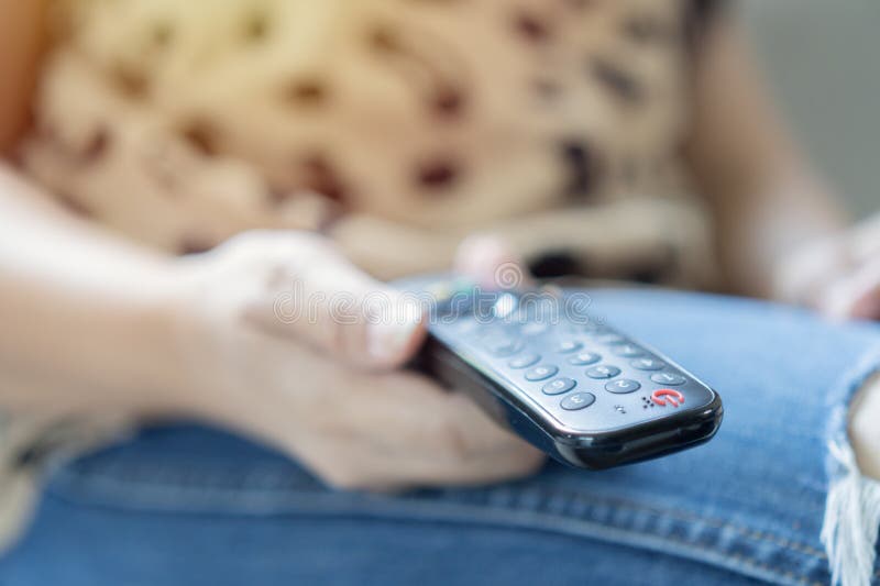 Television Remote Control in Female Hands Pointing To Tv Set and ...
