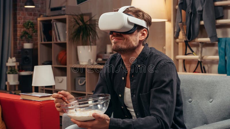 Television Sitcom Concept: Guy Using Virtual Reality Headset Eating ...