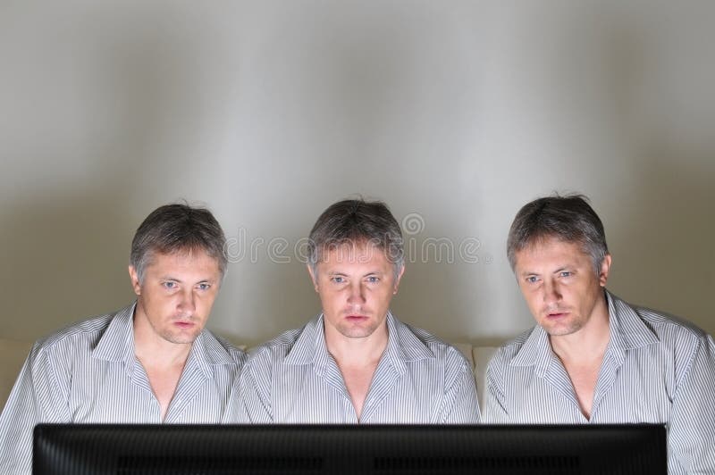 Television triplets stock image. Image of engrossed, brothers - 16199693