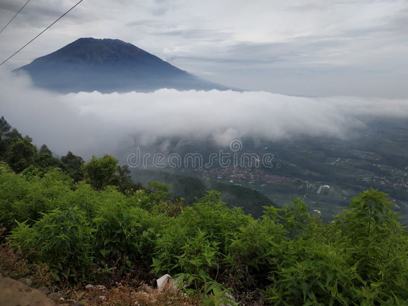 Telomoyo Mountain in Central Java Stock Photo - Image of clouds ...
