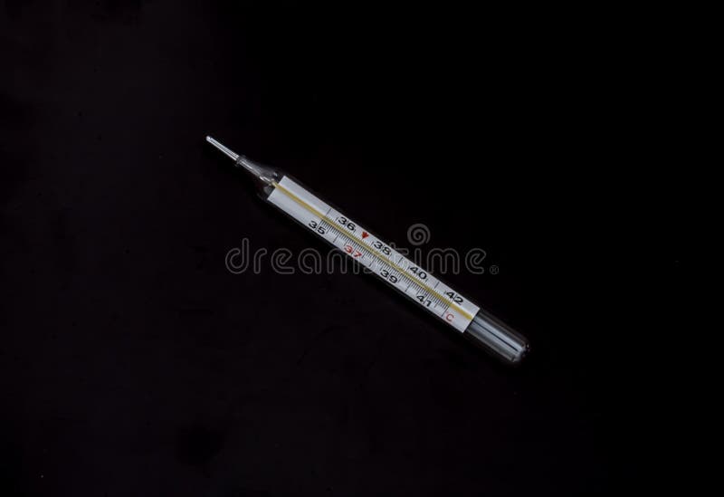 Temperature Measuring Device Thermometer on a Black Background Isolated ...