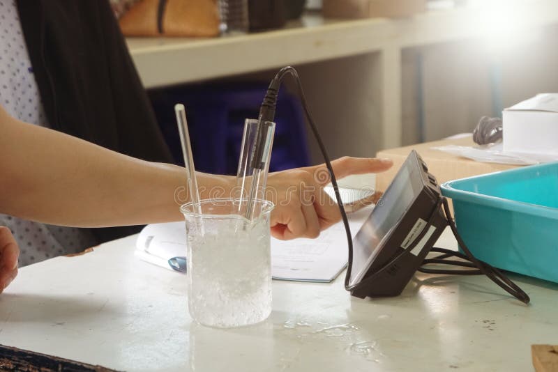 The Temperature Probe is Measuring the Ice Temperature in Beaker ...