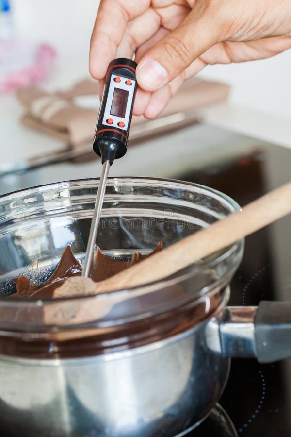 Tempering Chocolate stock photo. Image of melting, people - 65974858