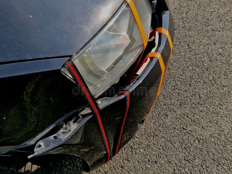Temporary Car Bumper Repair. the Fallen Part of the Vehicle is Attached ...