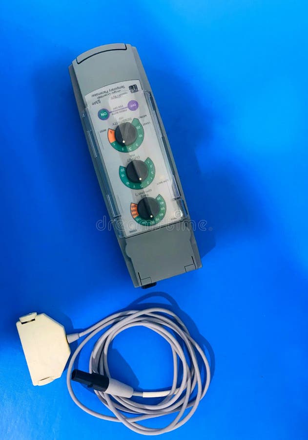 A Temporary Pacemaker Device with Connecting Cable Placed on a Blue ...