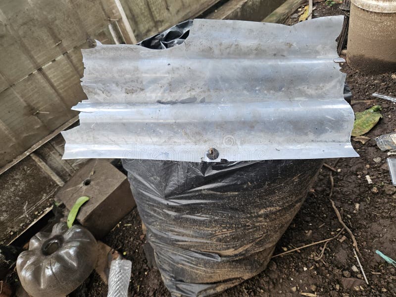 Temporary Trash Storage with Metal Sheet Cover Stock Image - Image of ...