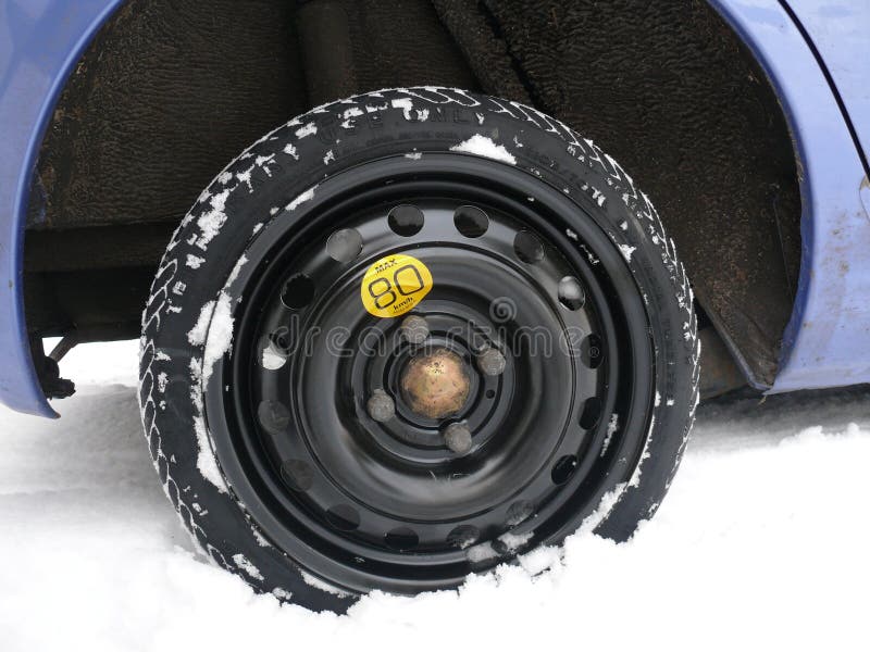 Temporary use spare tire stock photo. Image of snow, spare - 13312816