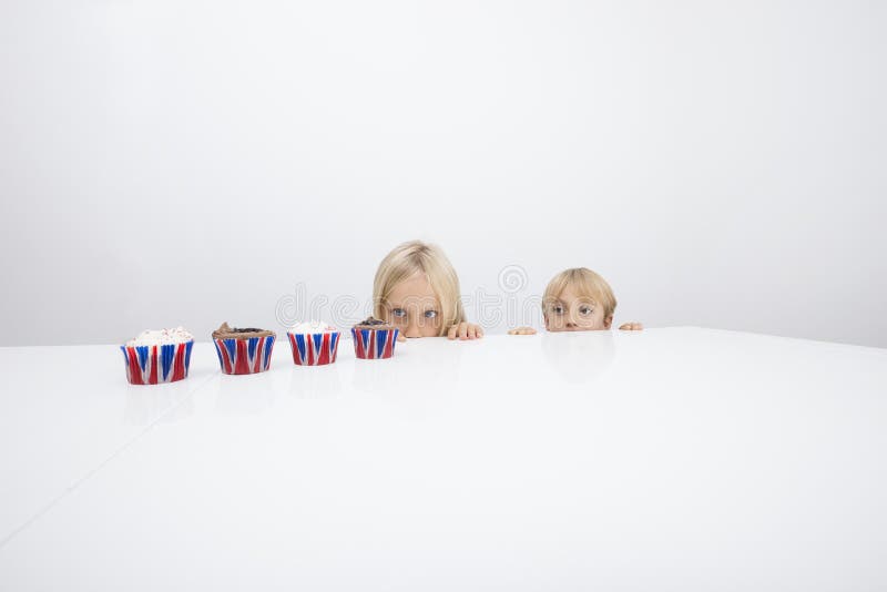 Tempted Girl Staring Cupcakes Table Stock Photos - Free & Royalty-Free ...