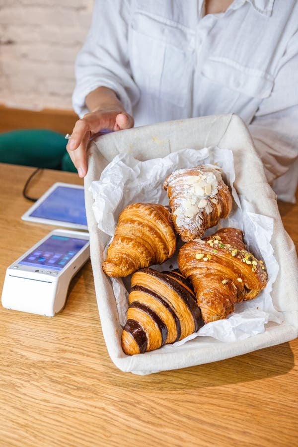 A Tempting Display of Croissants in a Wooden Basket at the Checkout ...