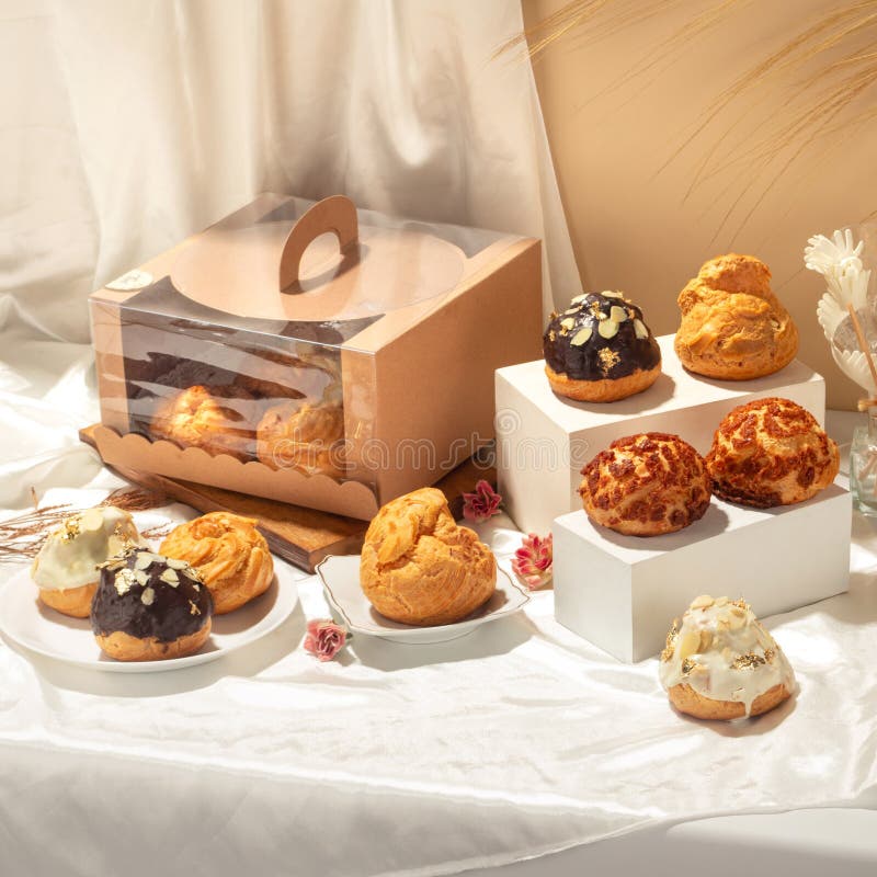A Tempting Display Features Cream Puffs Topped with Chocolate and ...