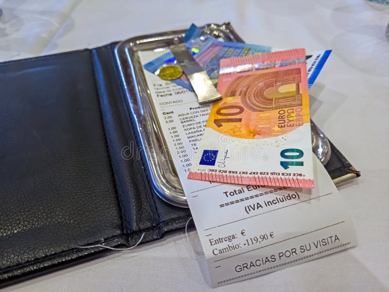 Ten Euro Bill with Coins on Plate on Wooden Table in Restaurant ... Ten Euro Bill with Coins on Plate on Wooden Table in Restaurant ...