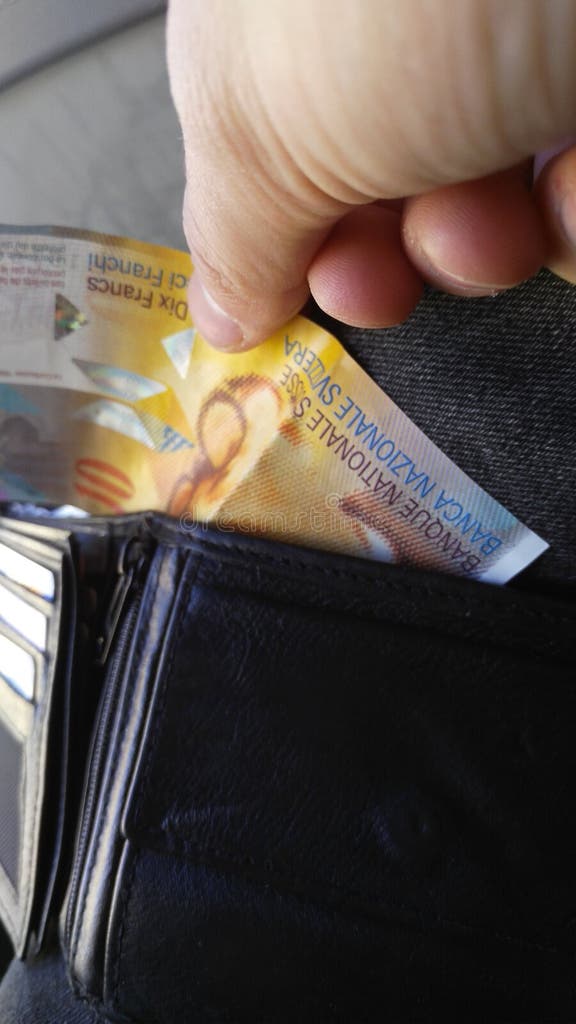 Man Taking Ten Swiss Francs from a Wallet Stock Image - Image of cash ...