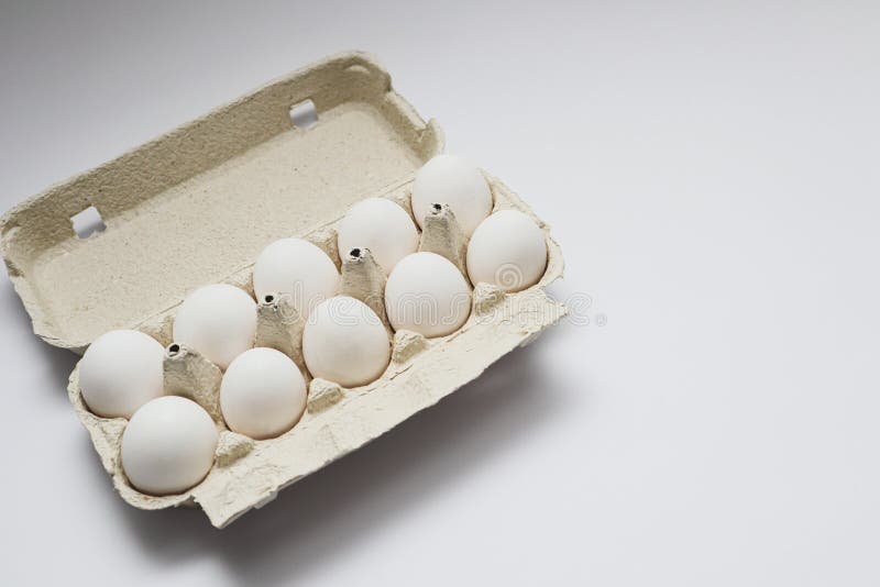 Ten White Eggs in a Carton Package. Cardboard Egg Box on Orange ...