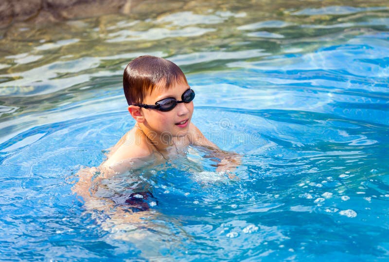 Ten Year Old Boy in Swimming Pool Stock Photo - Image of male, summer ...