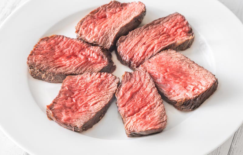 Perfectly Sliced Medium-rare Fillet Mignon Steak Served on a White ...