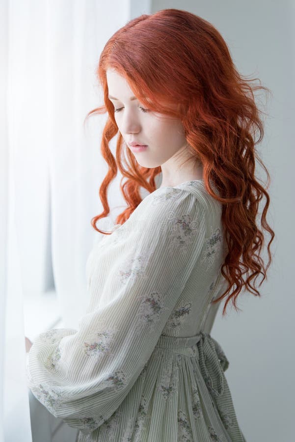 Tender Retro Portrait Of A Young Beautiful Dreamy Redhead Woman Stock