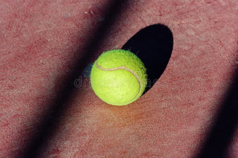 Tennis Ball on the Ground and Its Shadow Stock Image - Image of hobby ...