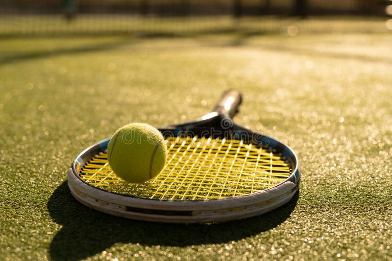 Tennis Ball with Racket on the Racket in Tennis Court Stock Image ...