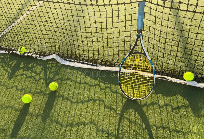 Tennis Ball and Racket on Hard Court Under Sunlight Stock Photo - Image ...