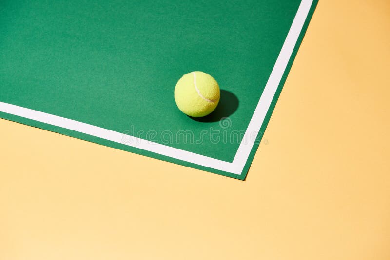 Tennis Ball with Shadow on Green and Yellow Surface Stock Image - Image ...