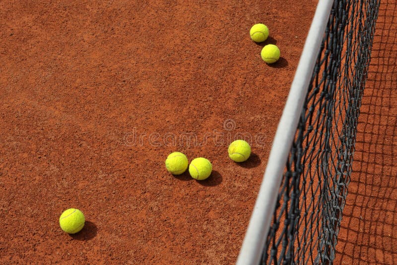 Tennis balls on court stock image. Image of shadow, clay - 36890269
