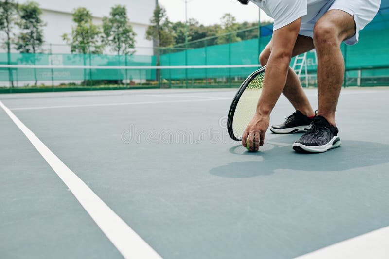 Tennis player taking ball stock image. Image of action - 175127411