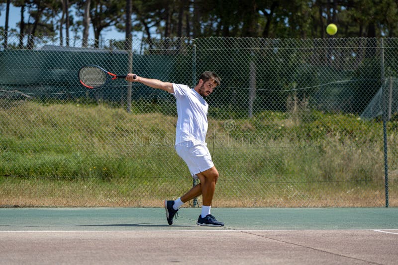 Tennis Player Hitting Backhand at Ball Stock Image - Image of club ...