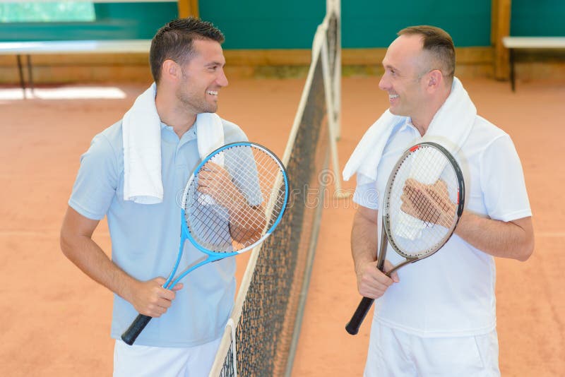 Tennis players having talk stock photo. Image of bounce - 88082550