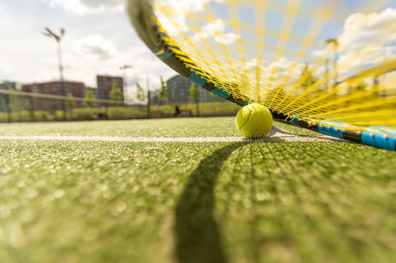 Tennis Racket with a Tennis Ball on a Tennis Court Stock Photo - Image ...